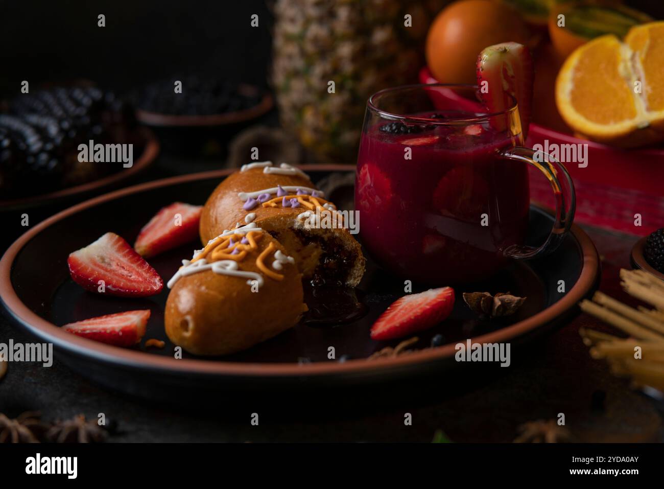 Guagua de pan with cup of colada morada, traditional Ecuadorian food ...