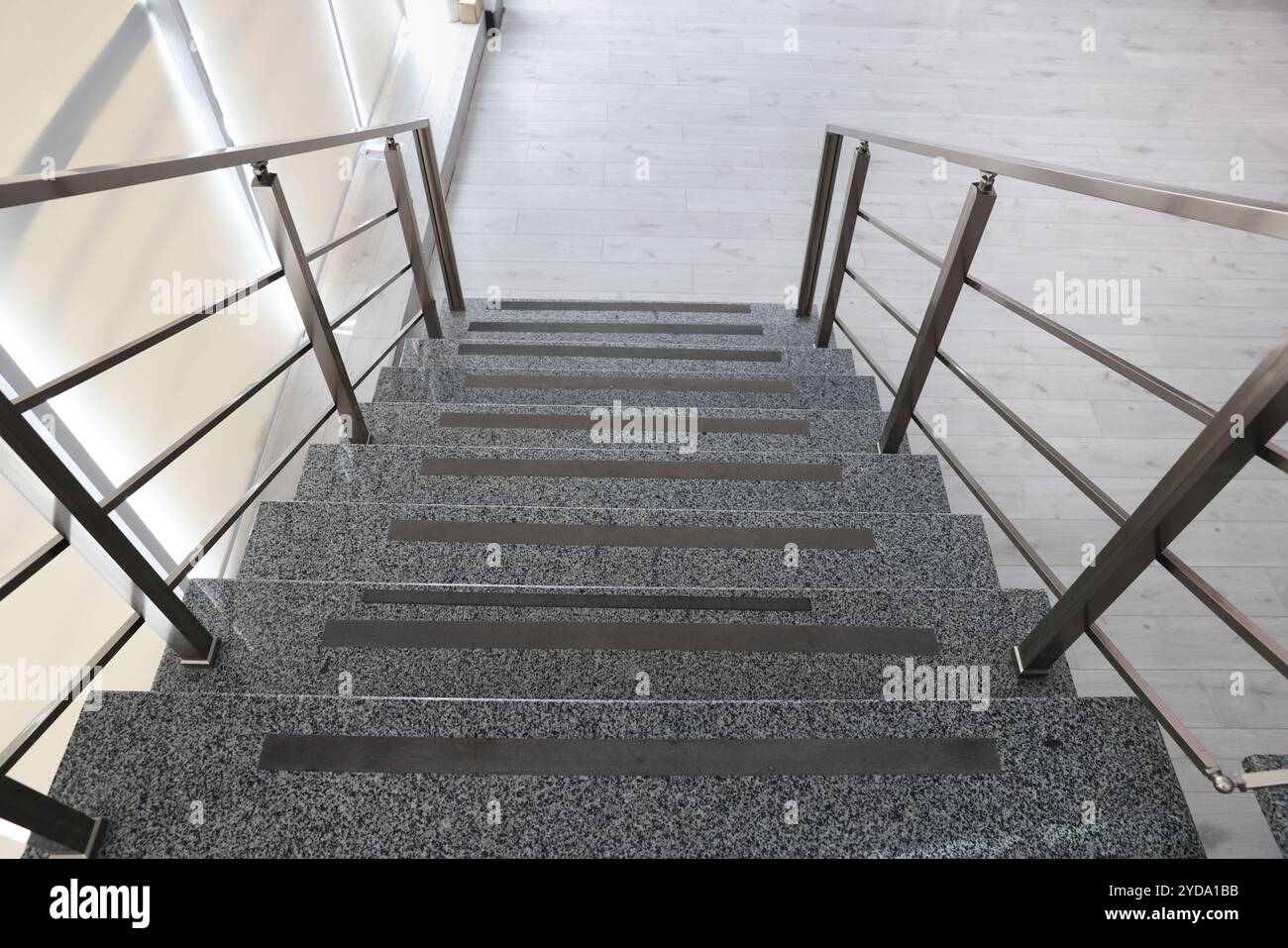 Empty staircase and metal railing indoors. Interior design, above view ...