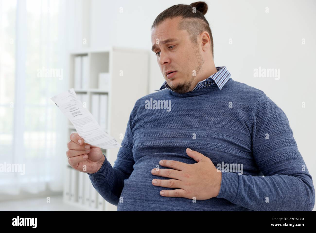Sad overweight man in hi-res stock photography and images - Alamy