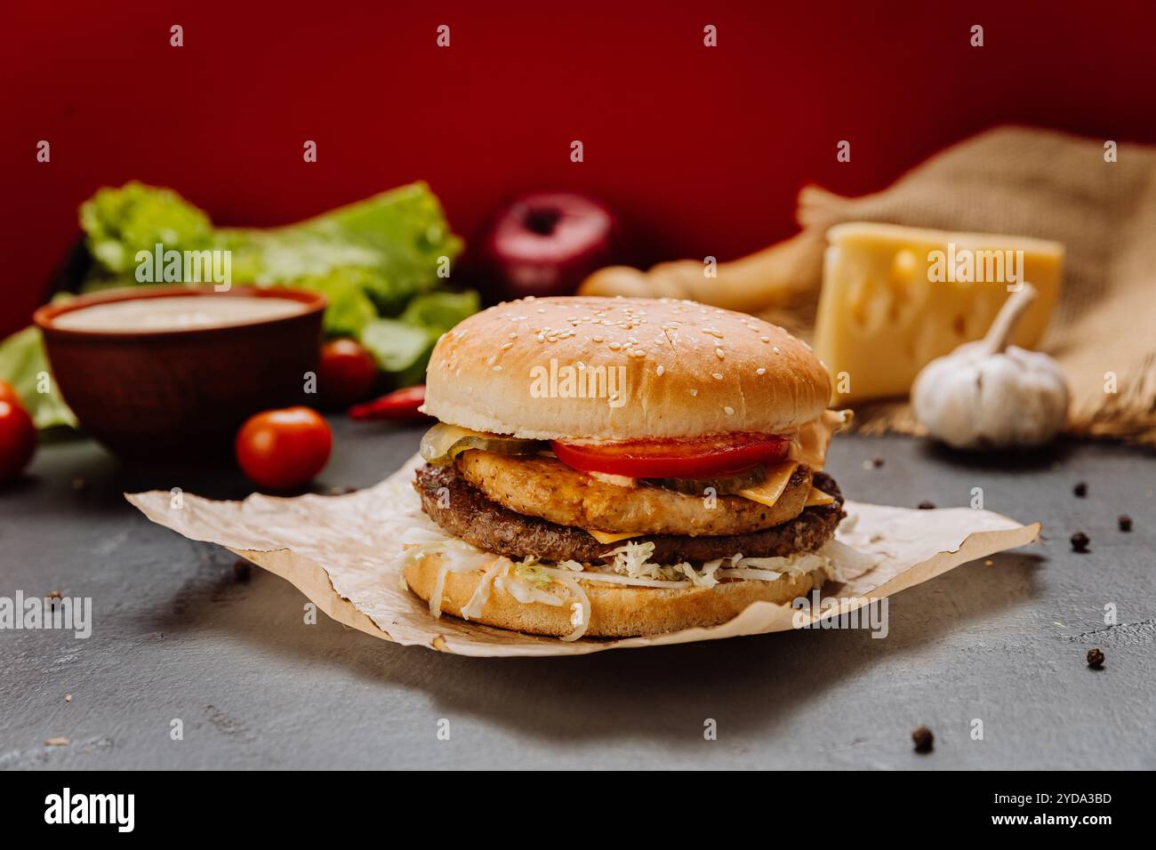 Delicious double-layered cheeseburger with fresh veggies and melted ...