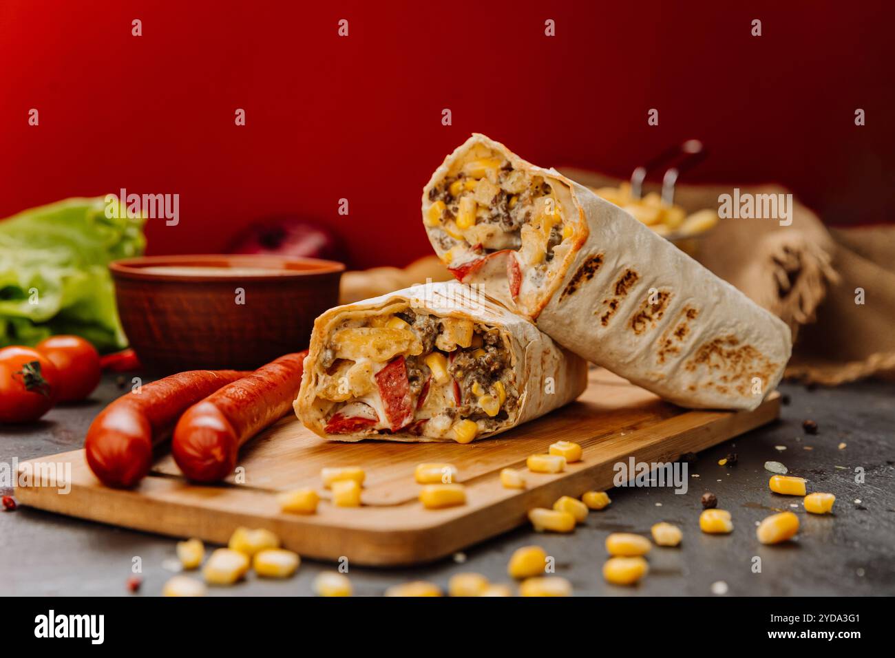 Grilled wrap filled with sausage, corn, and melted cheese. Hearty meal ...