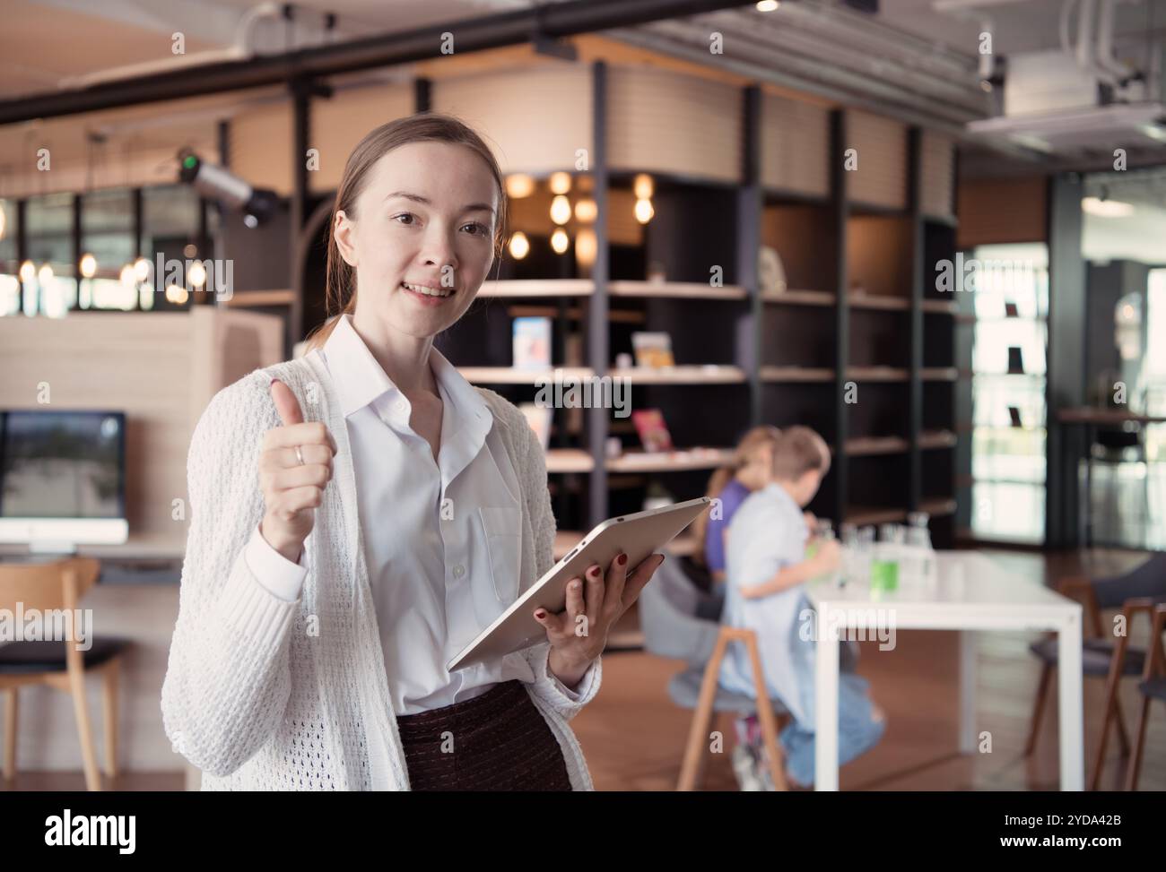 Science classroom teacher review lesson plans before teaching students ...