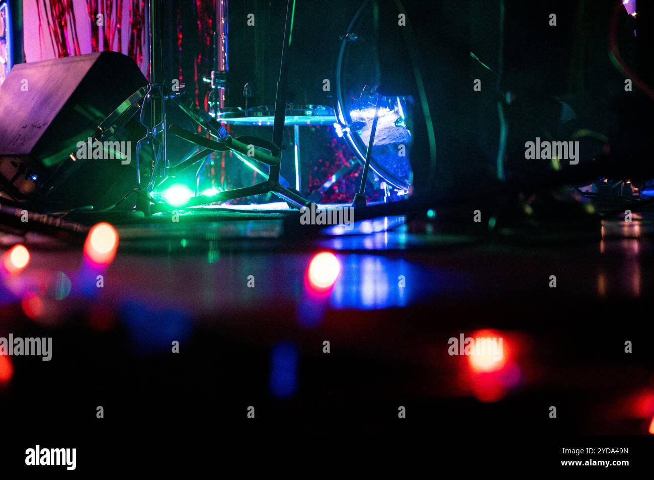 Empty stage before a local house show set up with Christmas lights with ...