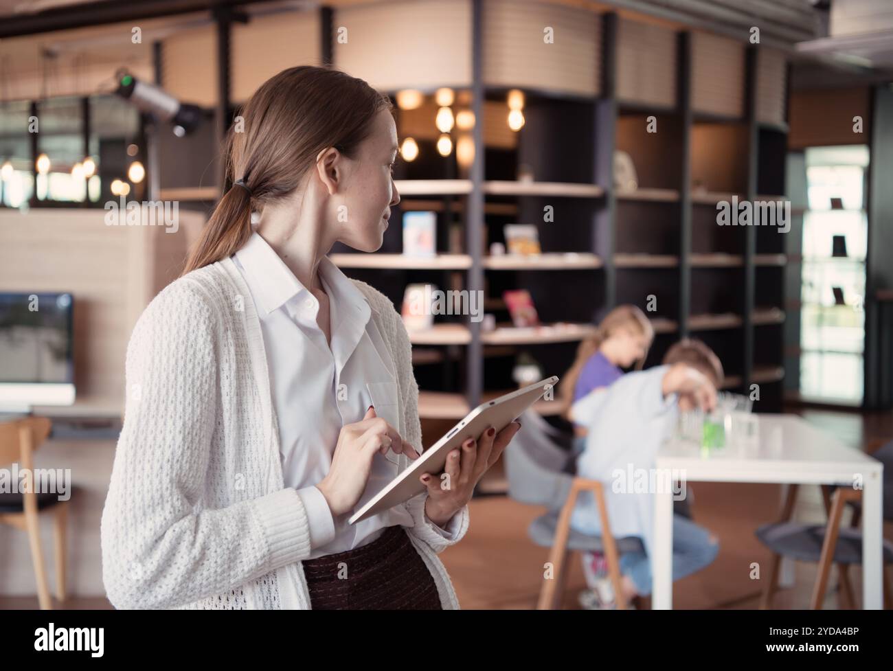 Science classroom teacher review lesson plans before teaching students ...