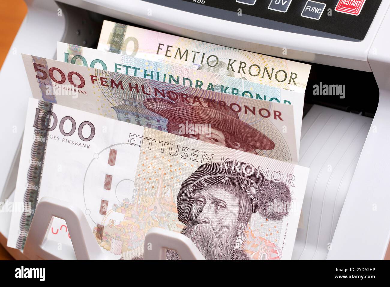 Swedish crown in the counting machine Stock Photo - Alamy