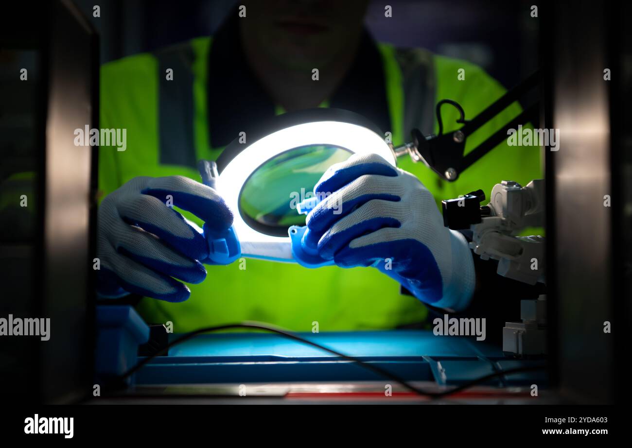 The technician must use bright lights and a magnifying glass to check ...