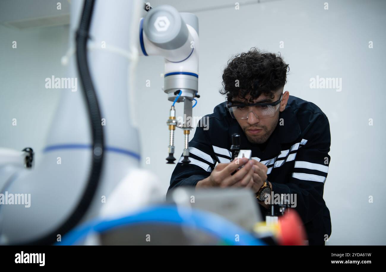 Students studying robotic hand technology are learning how to construct robotic hands for a ...