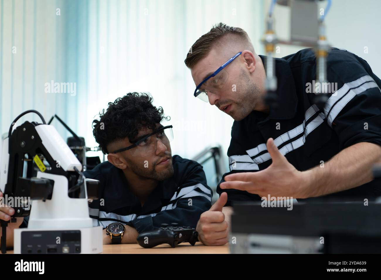 The robotic hand technology teacher is instructing new pupils on how to ...