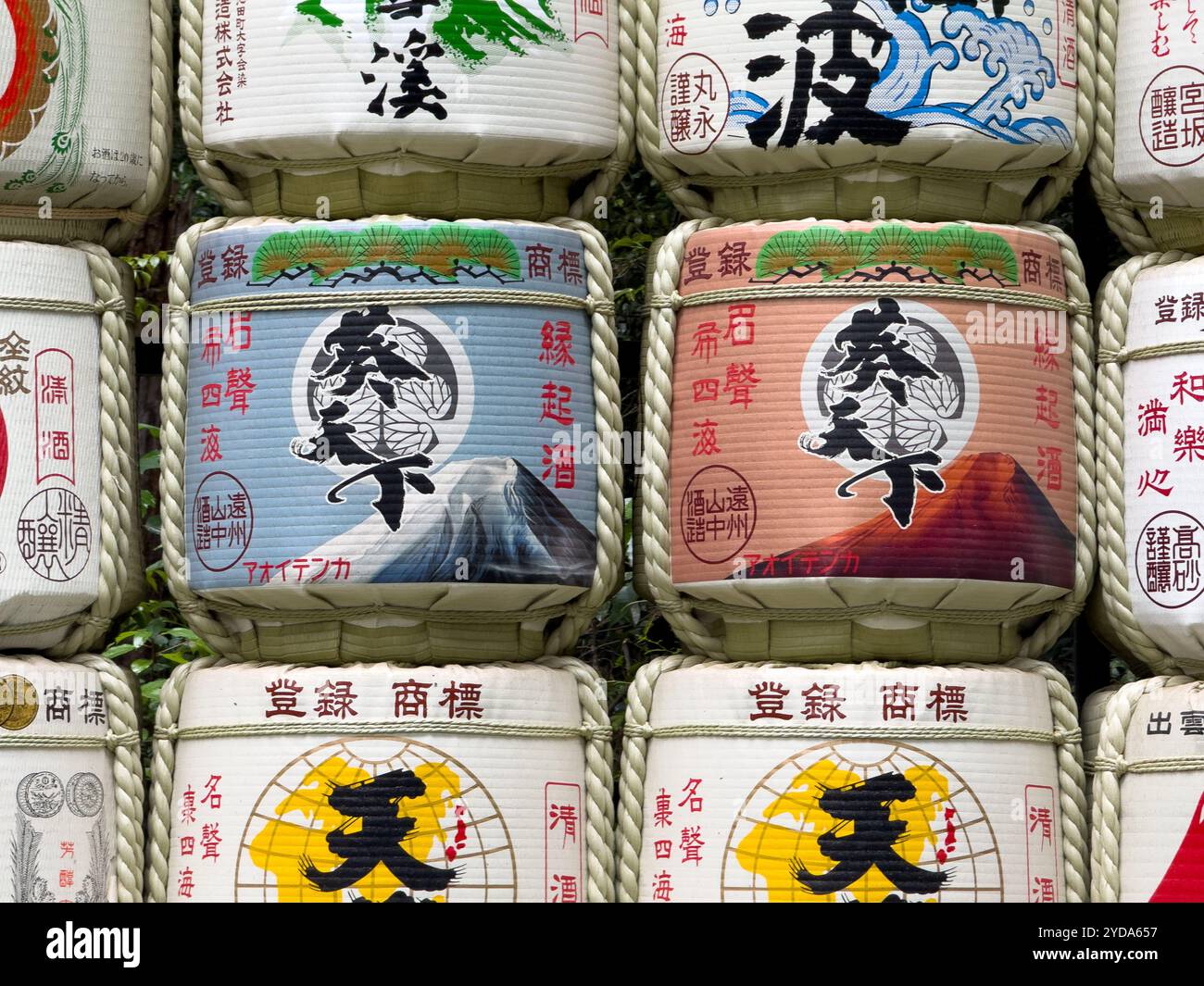 Japanese sake barrels are beautifully arranged in a display that ...