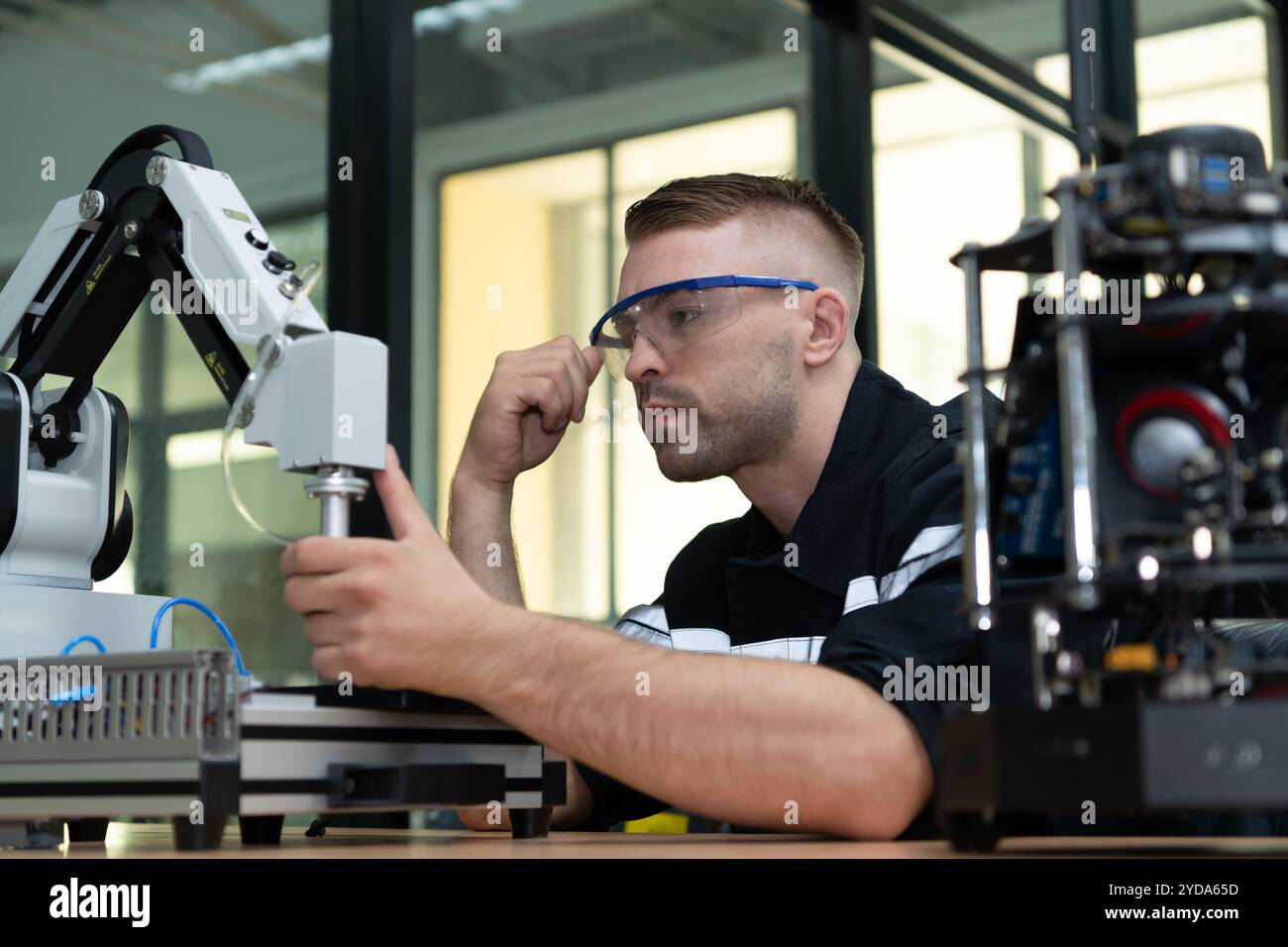 Students studying robotic hand technology are learning how to construct ...