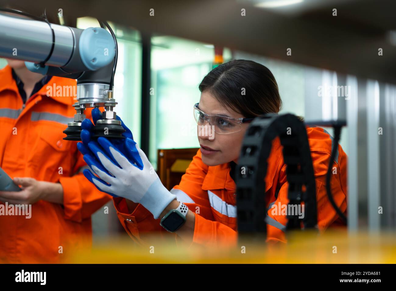Woman testing innovative robotic arm hi-res stock photography and ...
