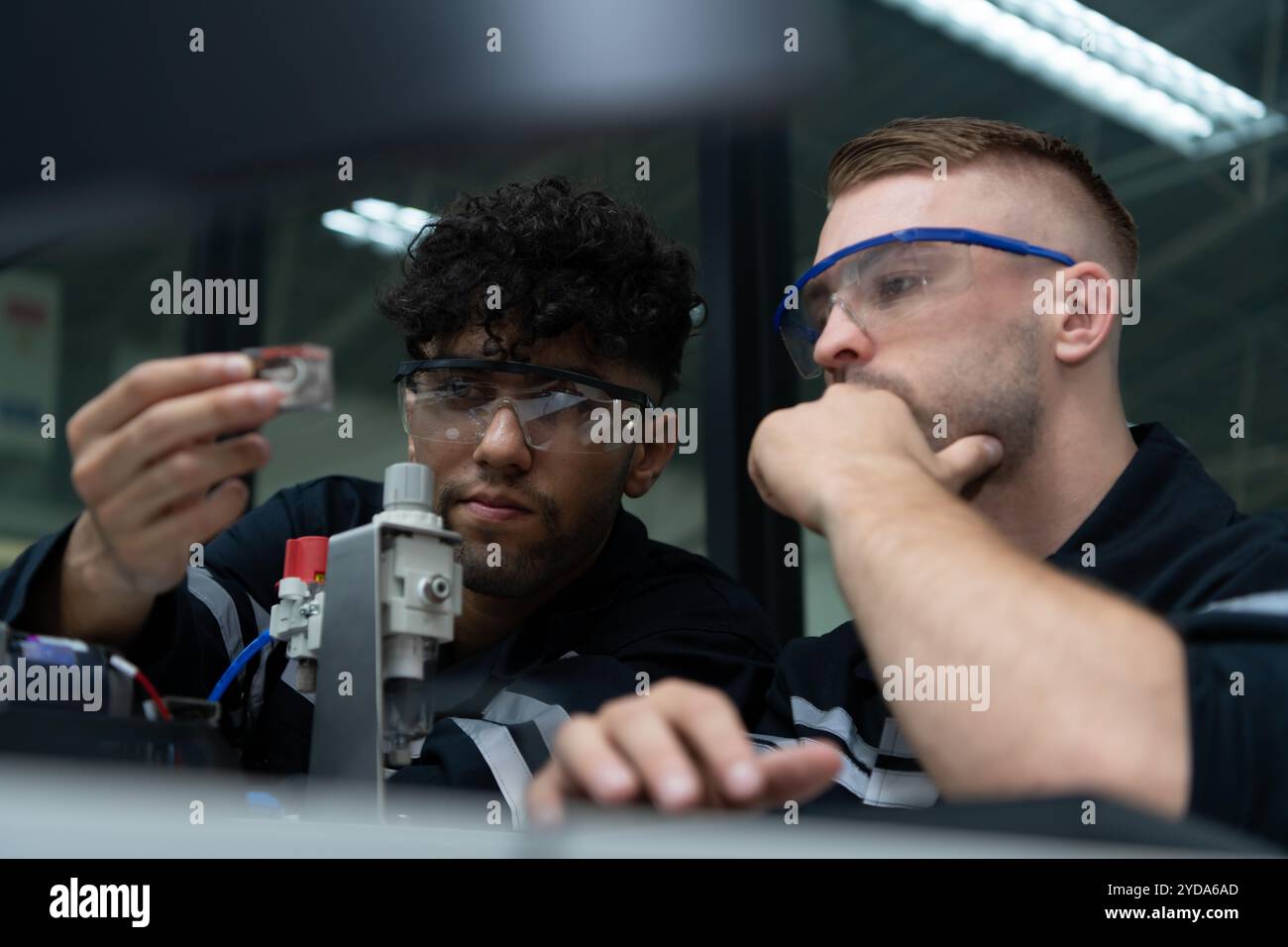 The robotic hand technology teacher is instructing new students on how ...