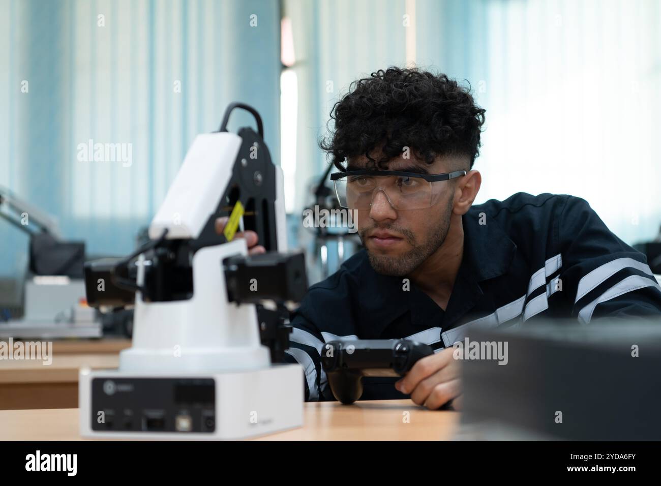 Students studying robotic hand technology are learning how to construct ...