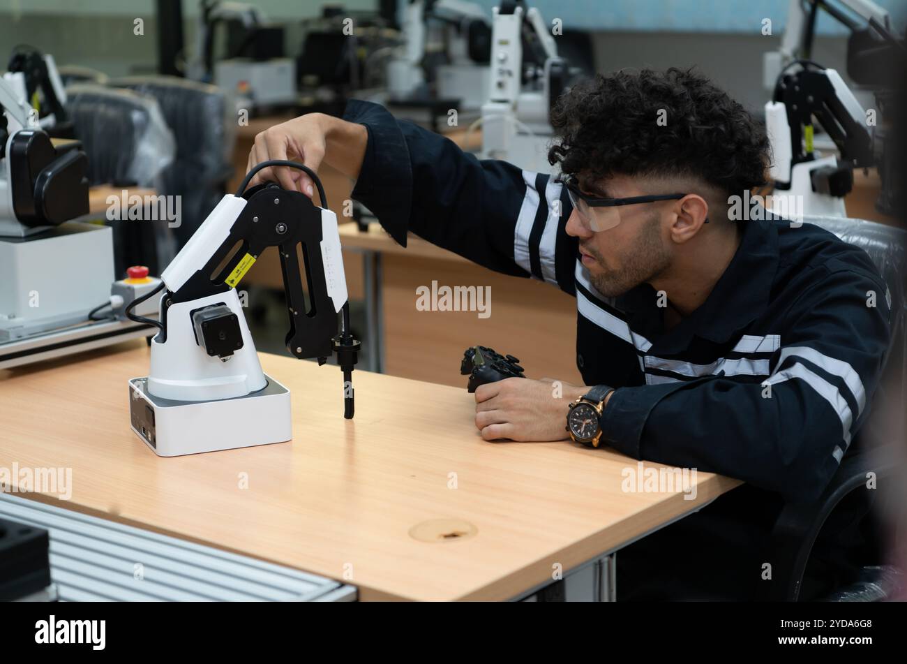 Students studying robotic hand technology are learning how to construct robotic hands for a ...