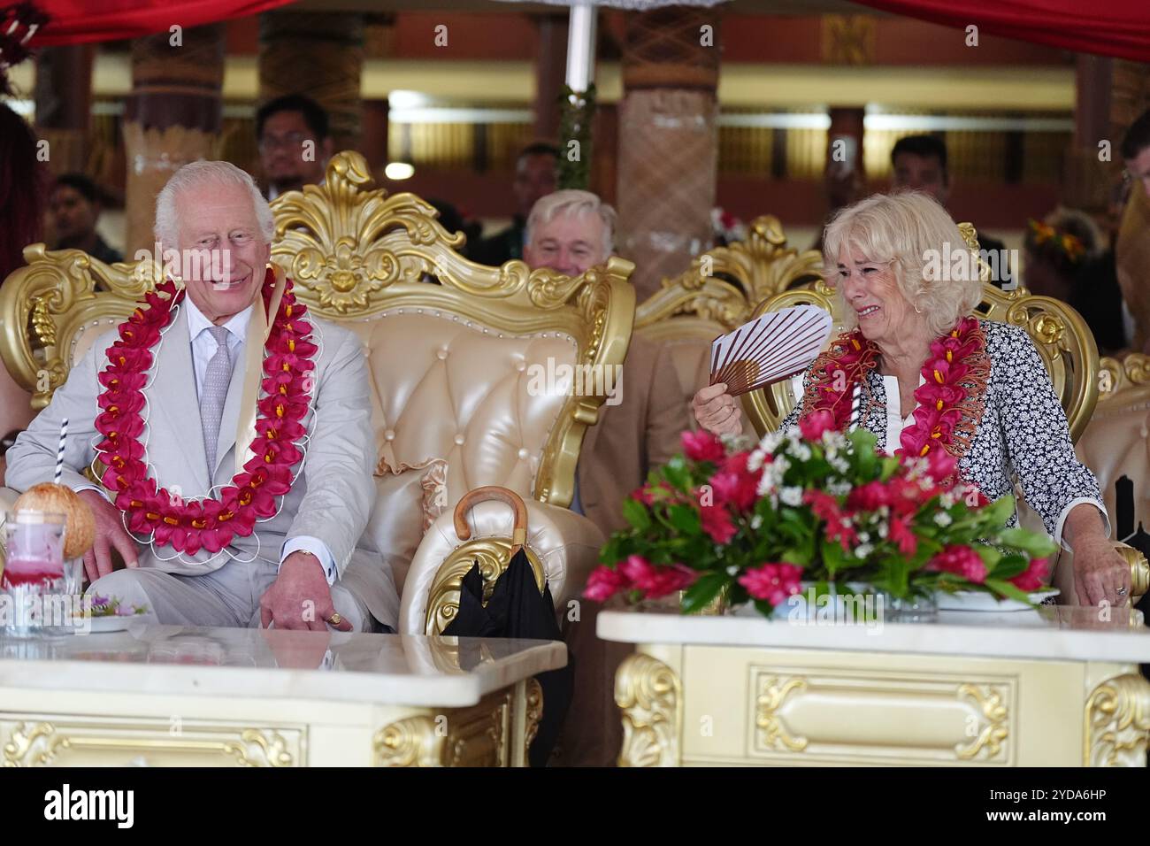 King Charles III and Queen Camilla laughing during a farewell ceremony ...