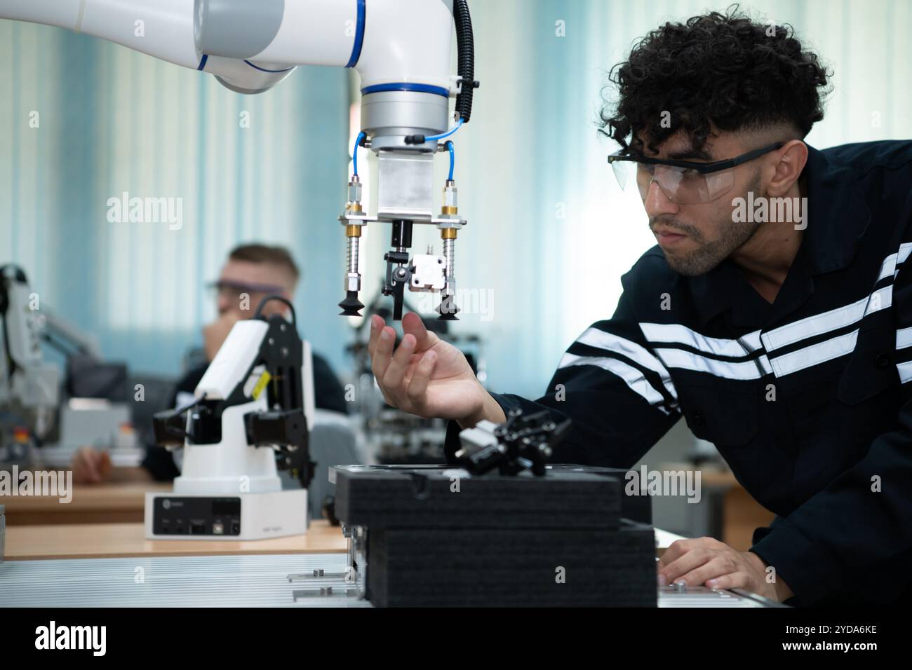 Students studying robotic hand technology are learning how to construct ...