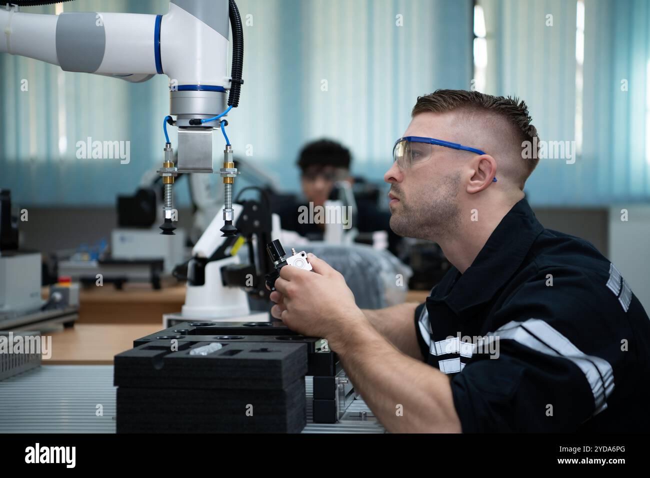Students studying robotic hand technology are learning how to construct ...