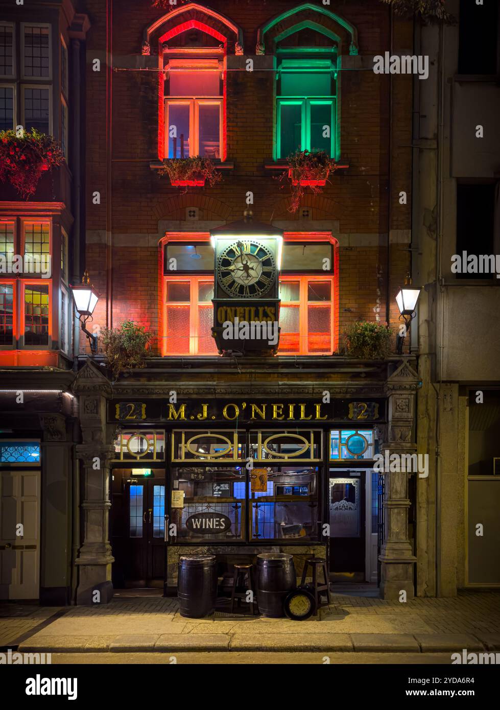 The Charming Facade of an Irish Pub at Night, Beautifully Adorned with ...