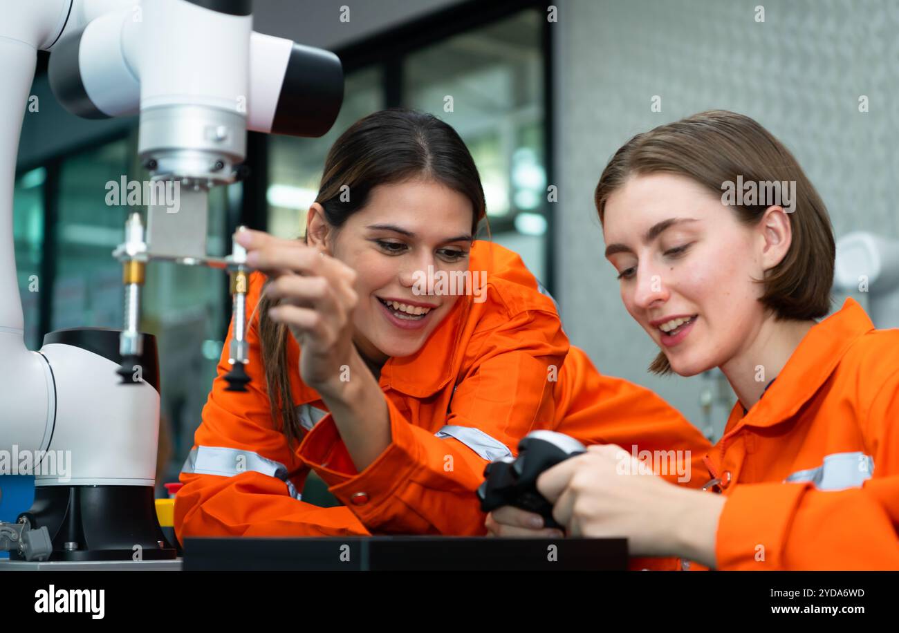 In an electronic parts facility, two female engineers In the plant ...