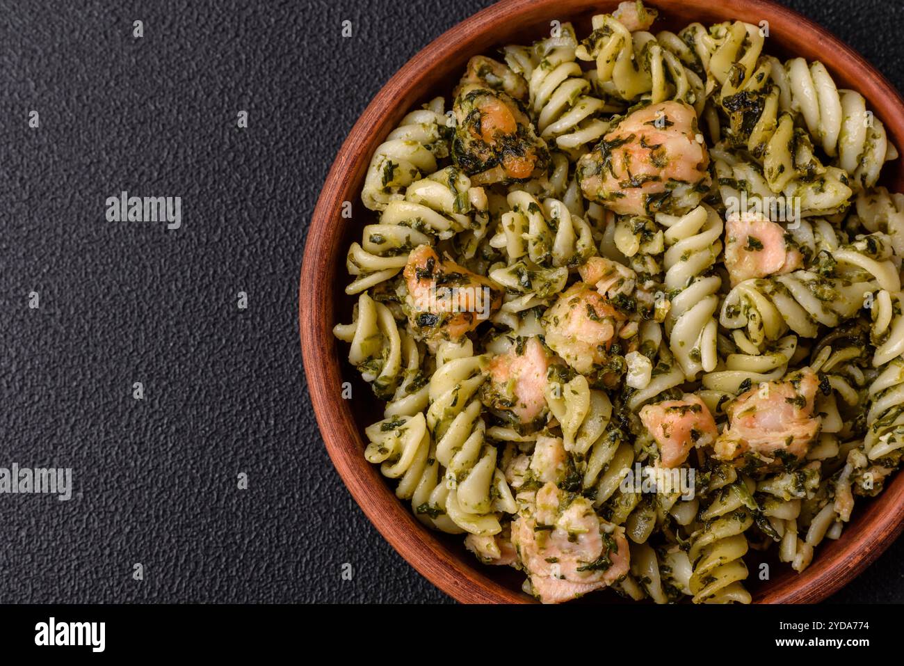 Delicious pasta with spinach, salmon, salt and spices Stock Photo - Alamy