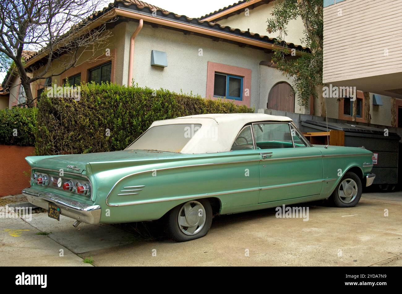 Classic Mercury Comet convertible car parked at apartment building in ...