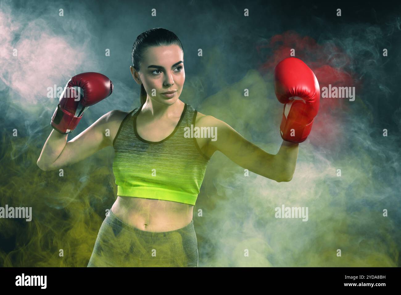 Boxer fighting in color smoke under spotlights Stock Photo - Alamy