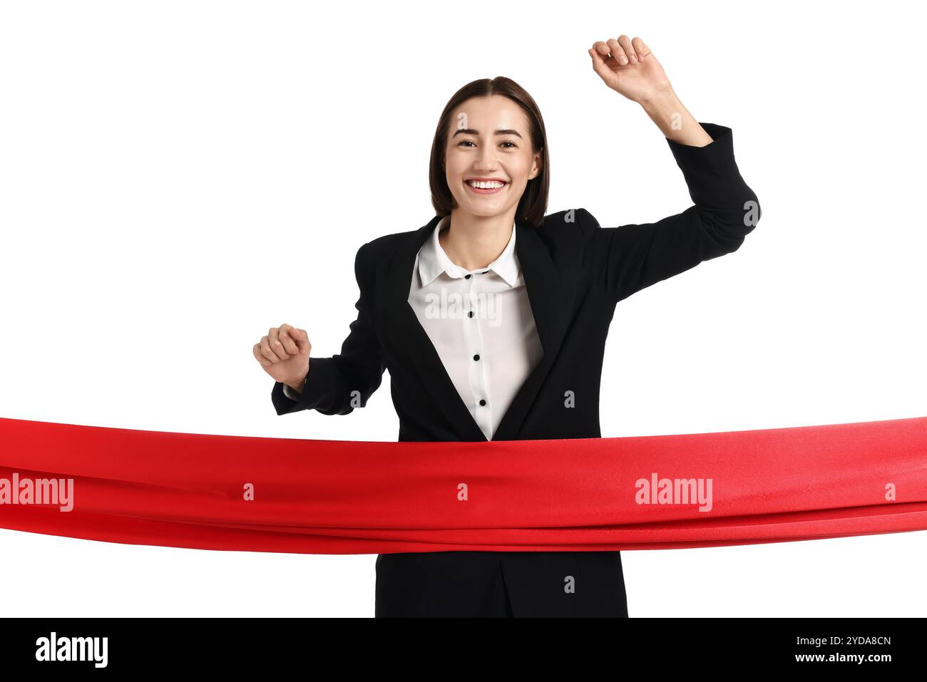 Young businesswoman in suit crossing red finish line on white ...