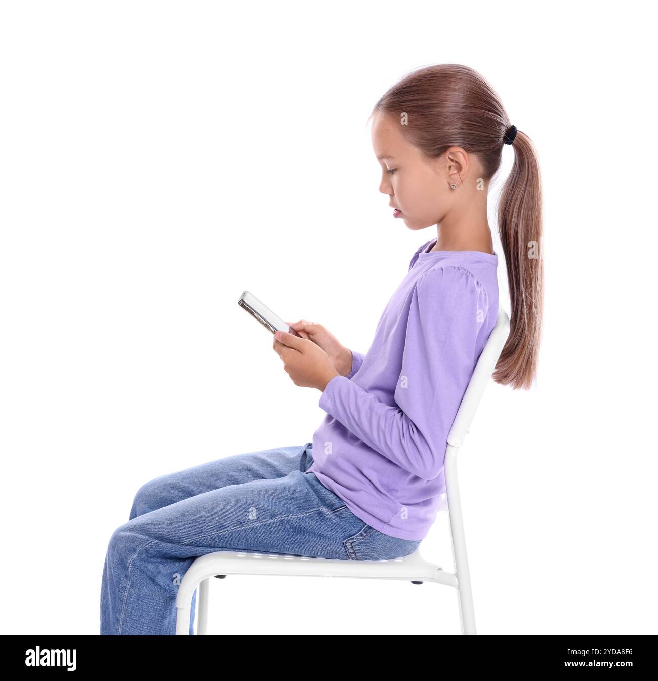 Girl with correct posture and smartphone sitting on white background ...