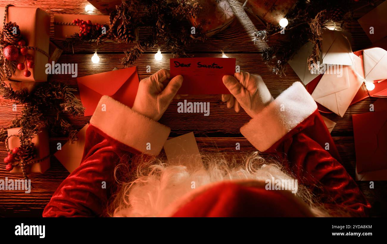 Santa Claus reading Christmas letters at his desk Stock Photo - Alamy