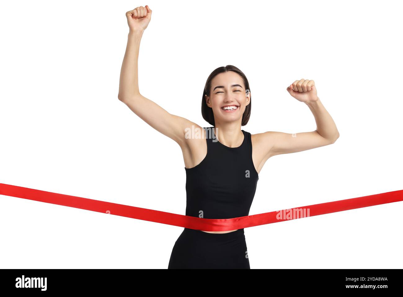 Beautiful woman in sportswear crossing red finish line on white ...