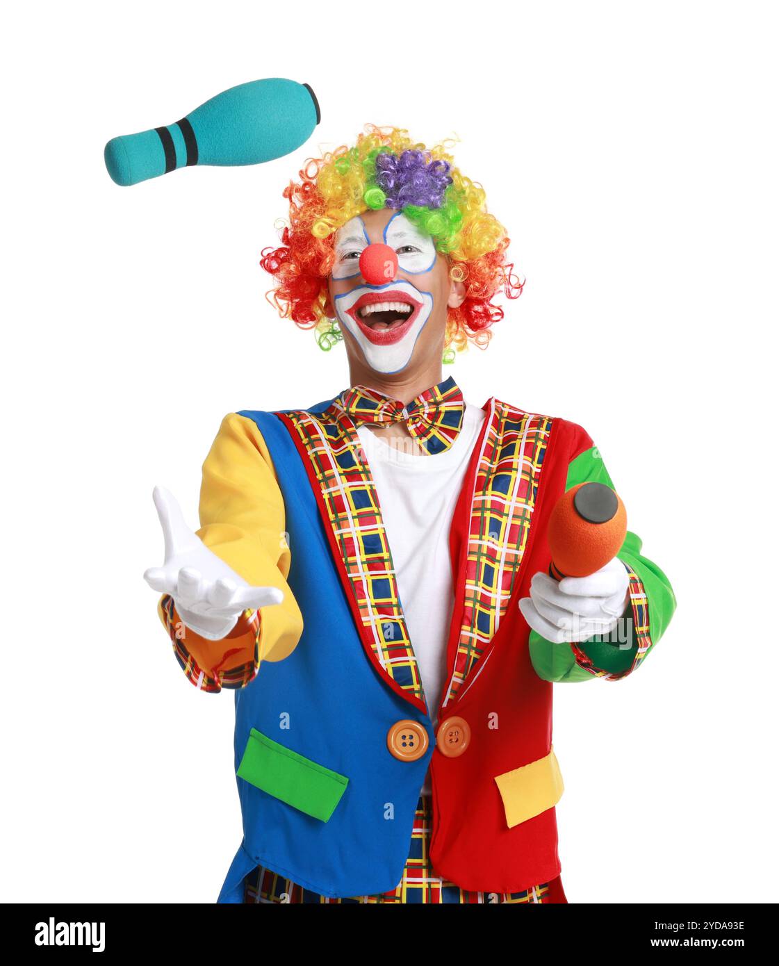 Happy clown juggling clubs on white background Stock Photo - Alamy