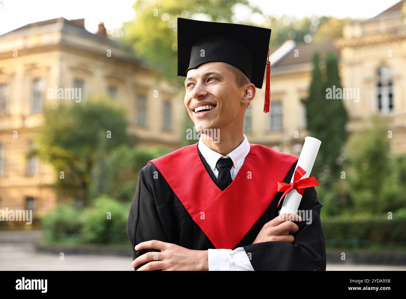 Happy student with diploma after graduation ceremony outdoors Stock ...
