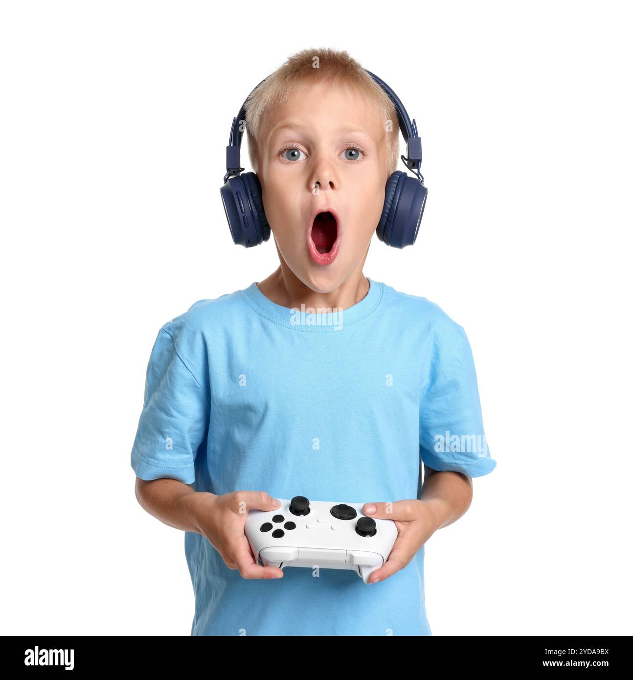Emotional little boy in headphones playing video game with controller ...