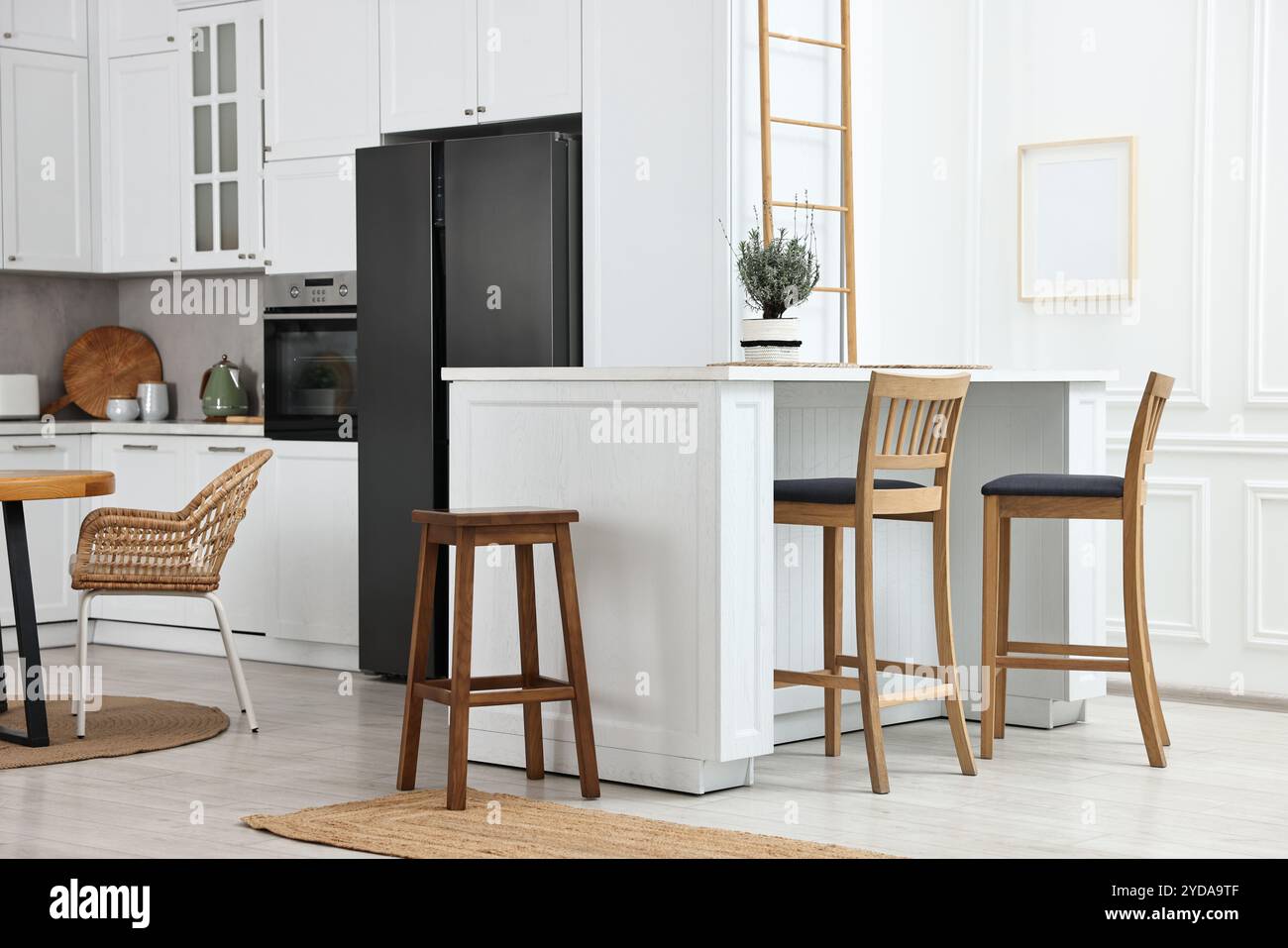 Stylish kitchen with bar stools. Interior design Stock Photo - Alamy