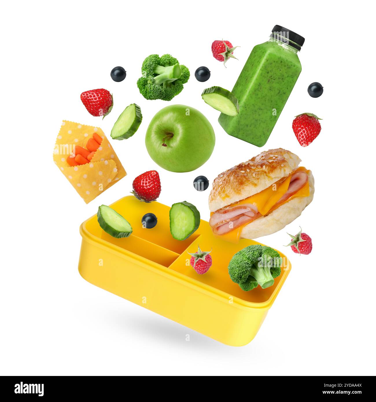 Lunch box, different food and bottle of juice in air on white ...