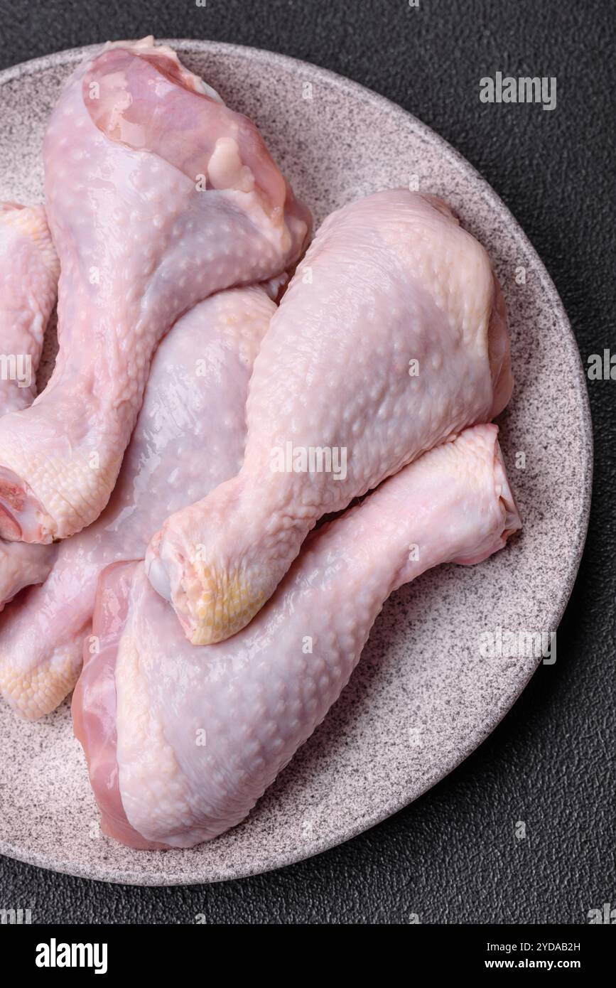 Fresh raw chicken legs with salt and spices Stock Photo - Alamy