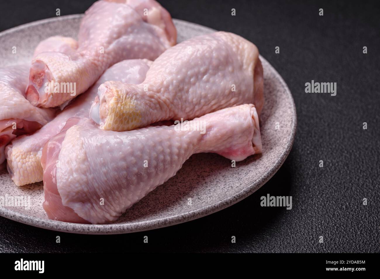 Fresh raw chicken legs with salt and spices Stock Photo - Alamy