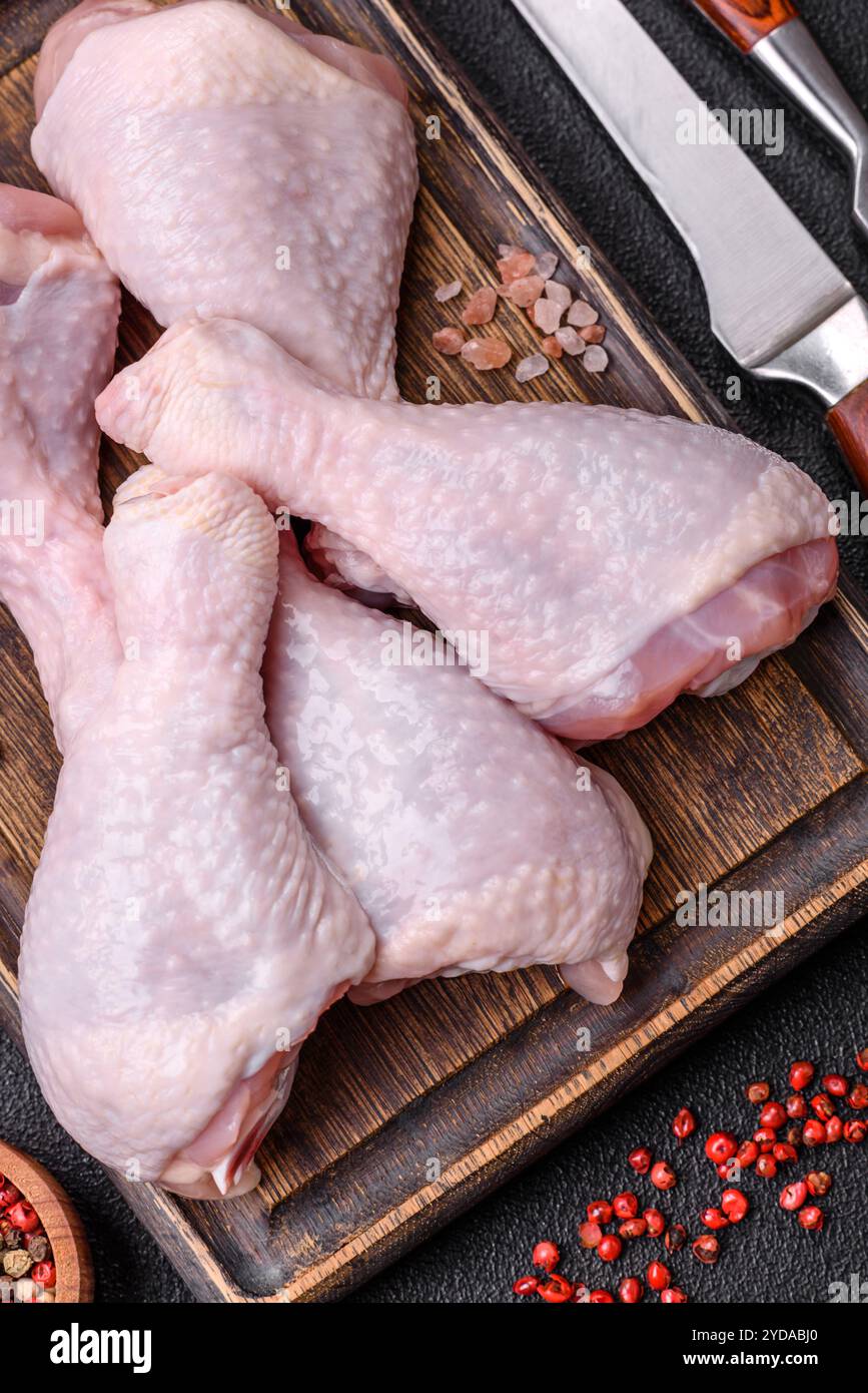 Fresh raw chicken legs with salt and spices Stock Photo - Alamy
