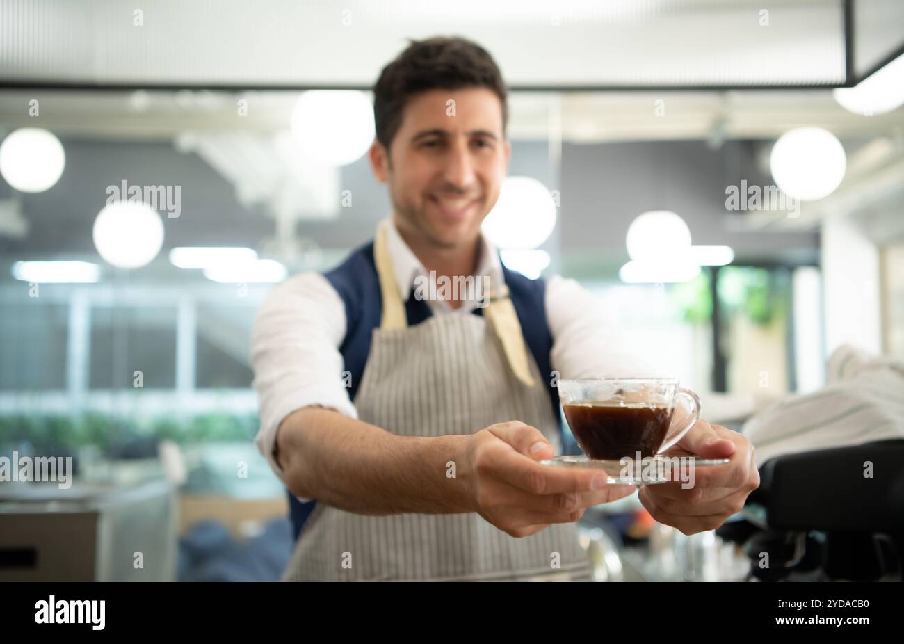 Coffee expert barista Making hot Americano for customers Stock Photo ...