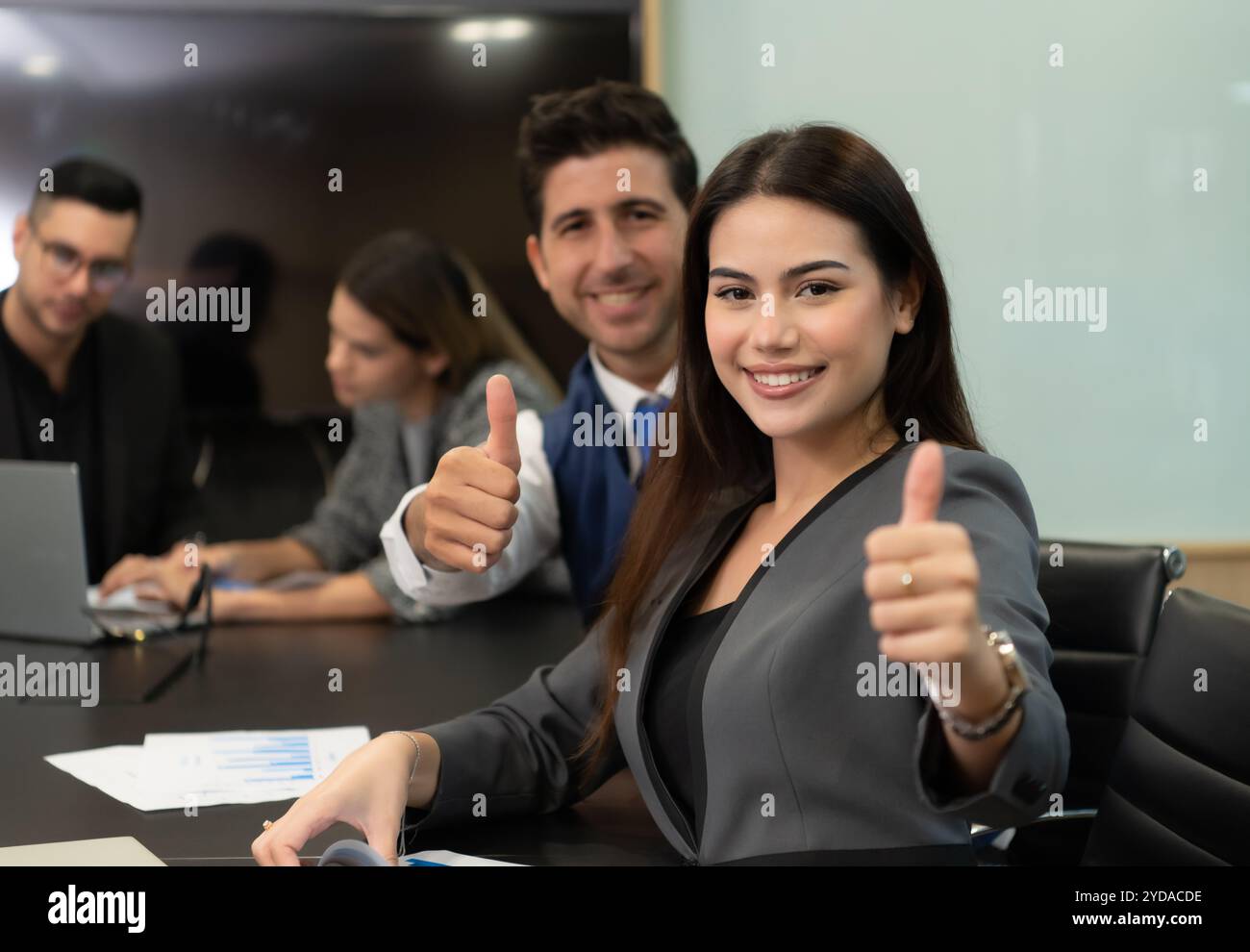 New business people in the conference room are exchanging information ...