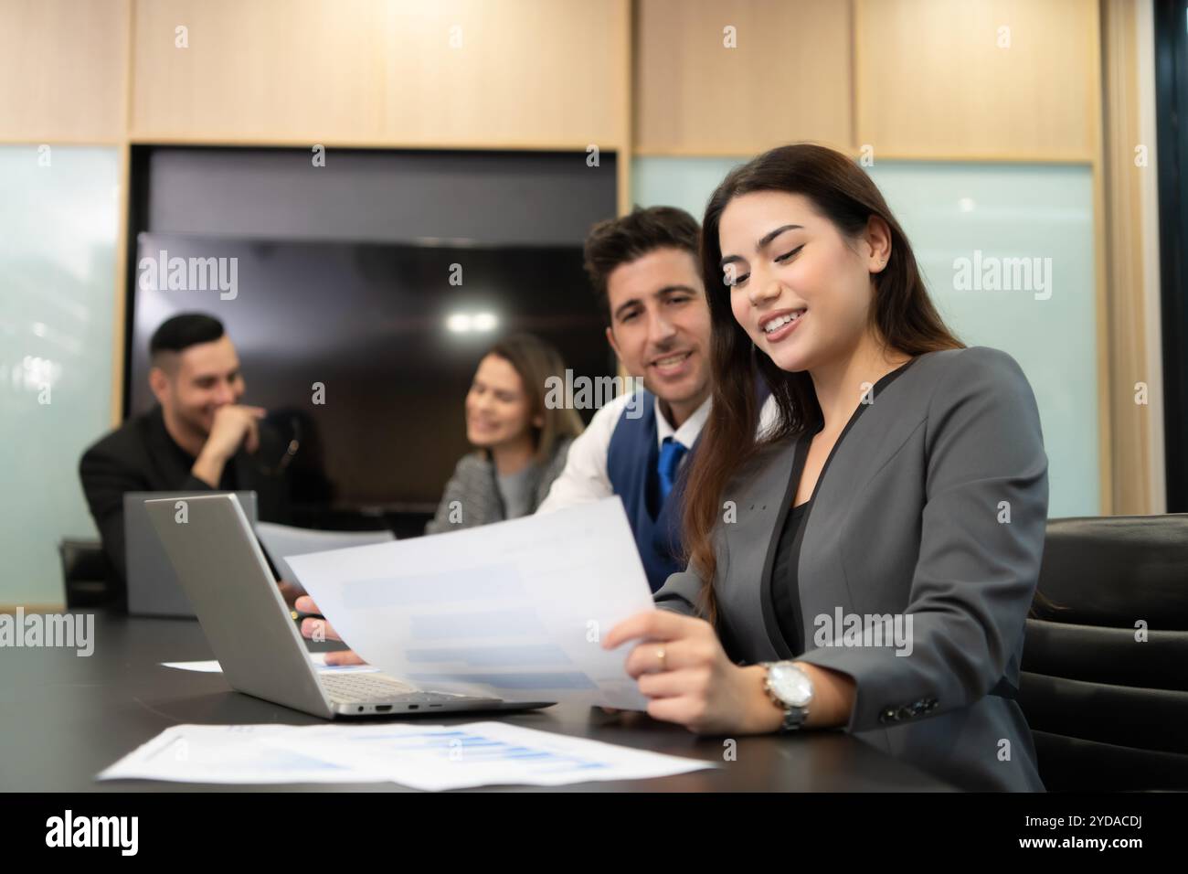 New business people in the conference room are exchanging information ...