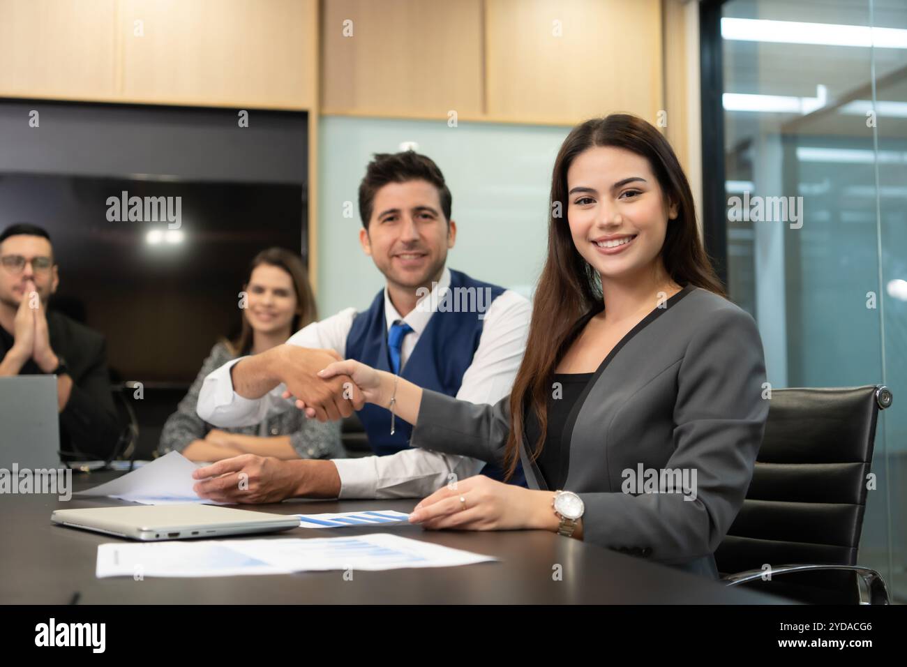 New business people in the conference room are exchanging information ...