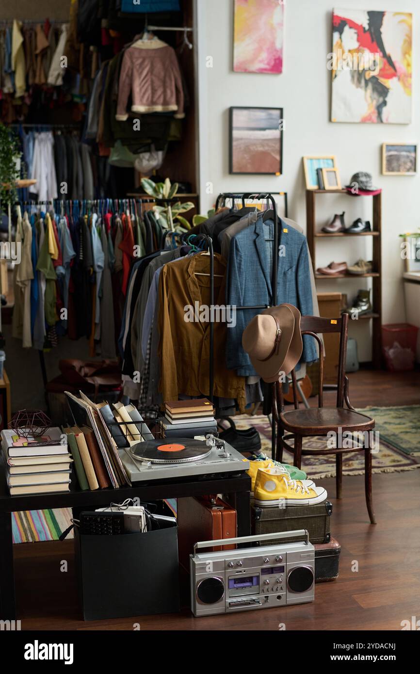 Set of outdated things standing on small table and on the floor against ...