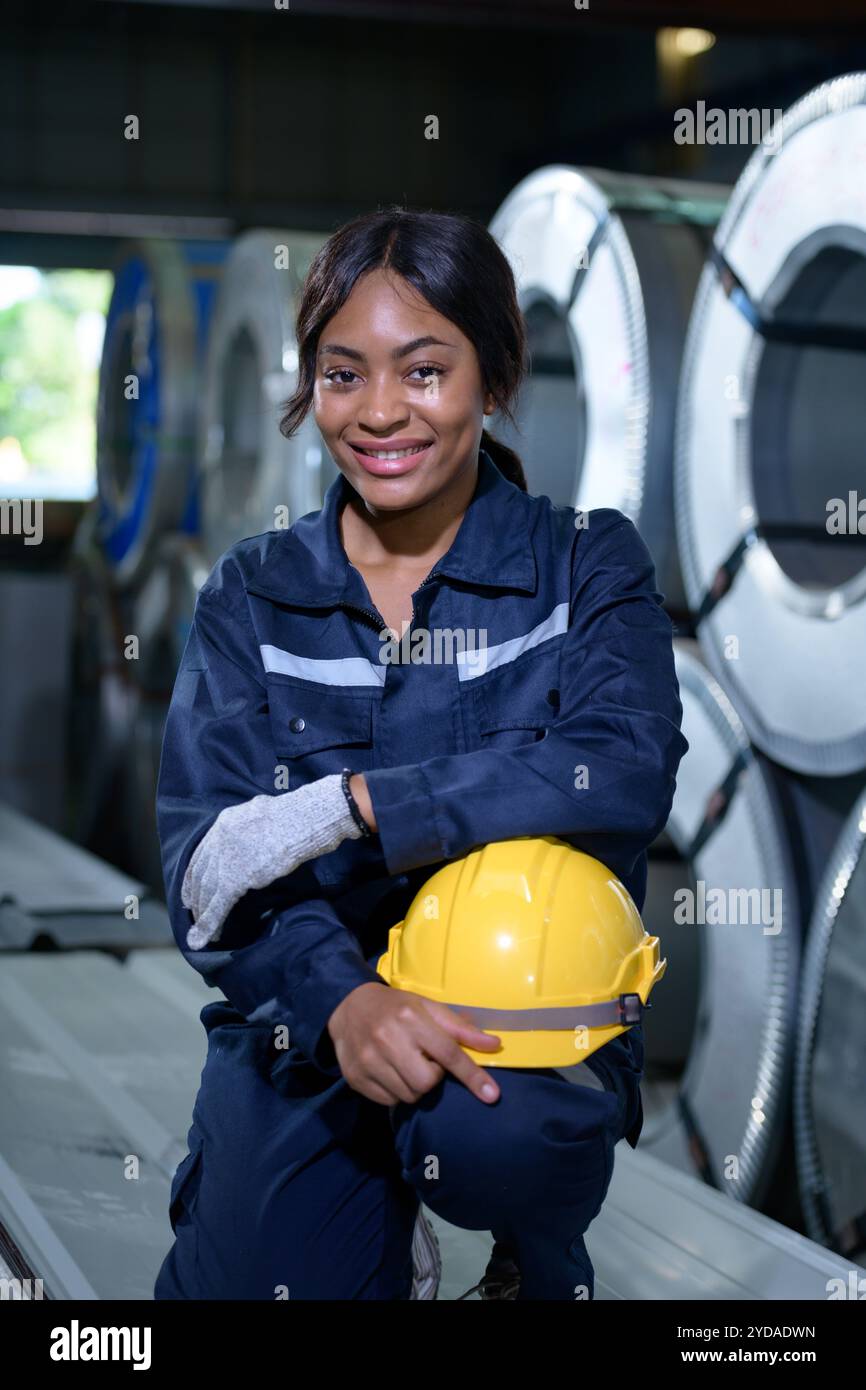 Portrait of a heavy equipment female engineer from a huge industry ...