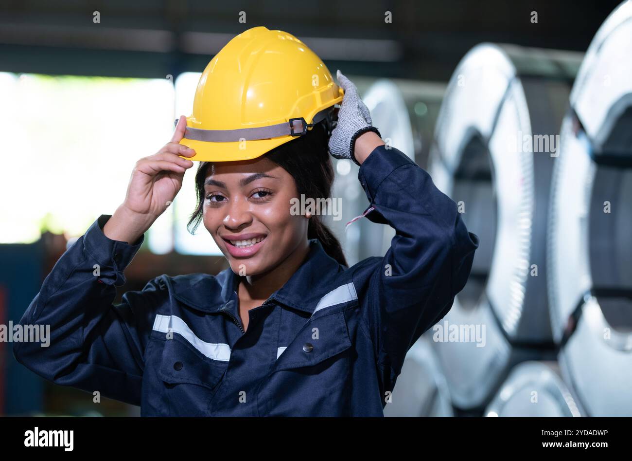 Portrait of a heavy equipment female engineer from a huge industry ...