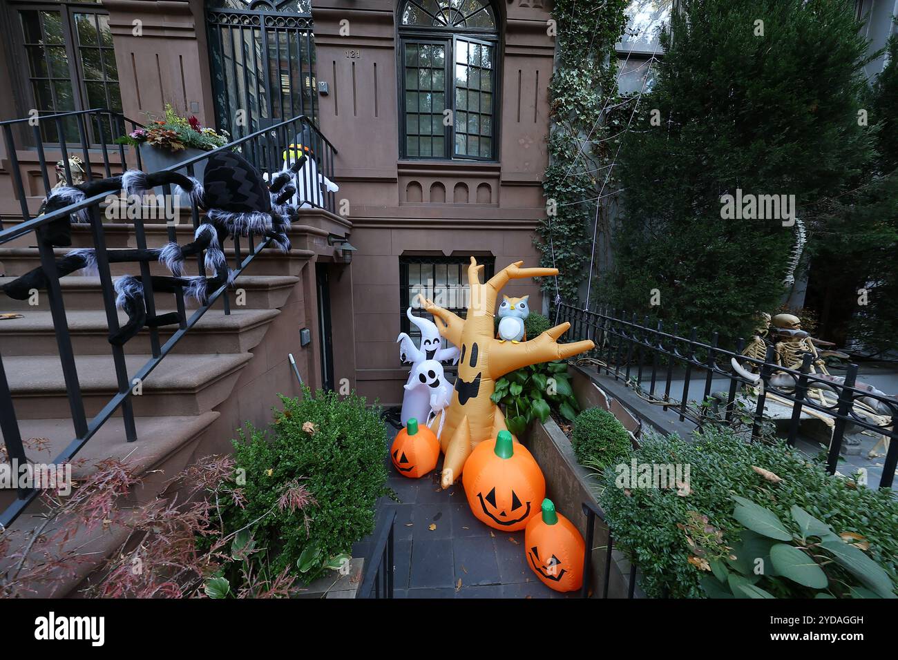 Inflatable pumpkins and ghosts in the yard outside of a Carnegie Hill ...