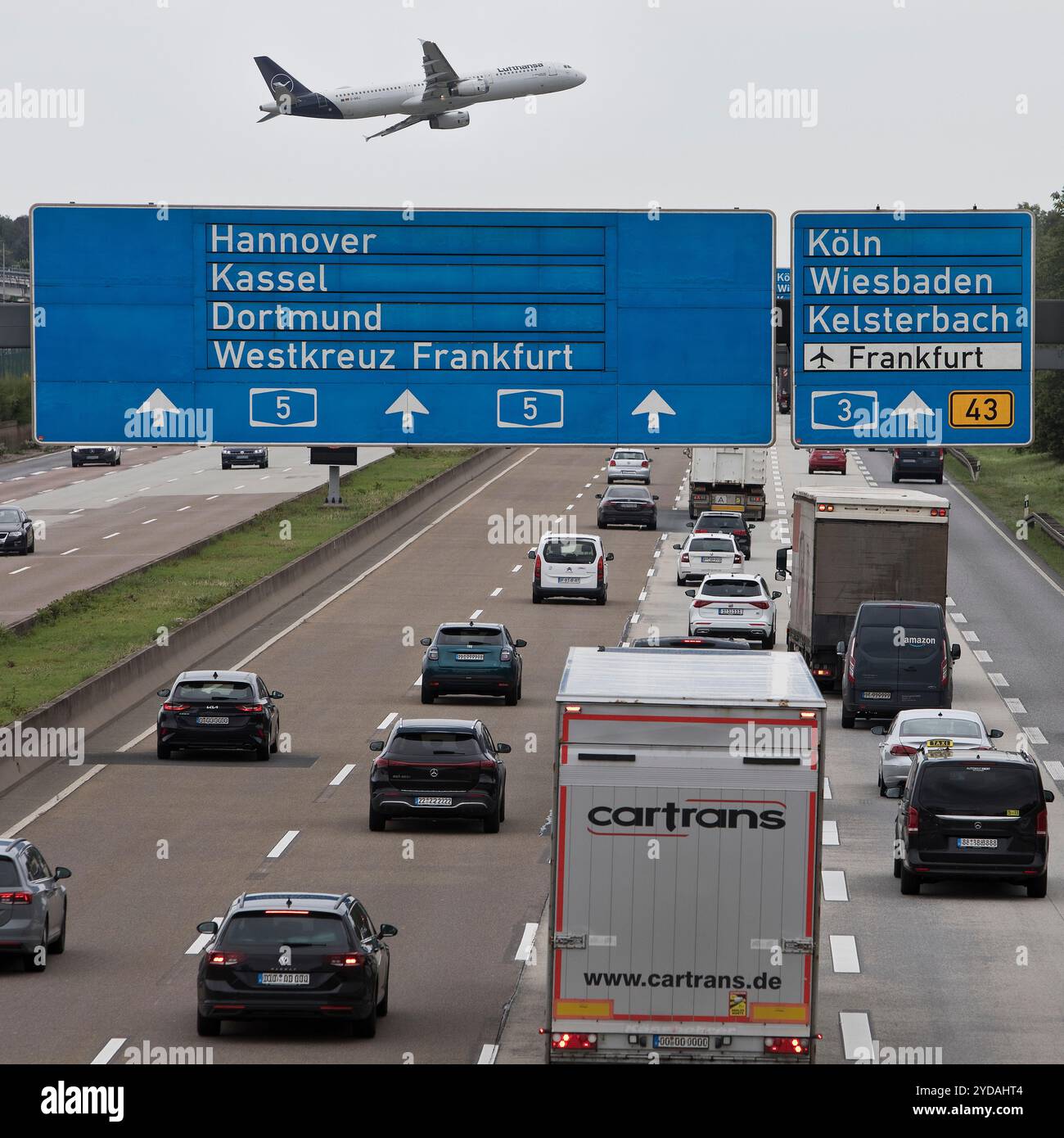 Airplane from the airport above the traffic on the A5 motorway ...