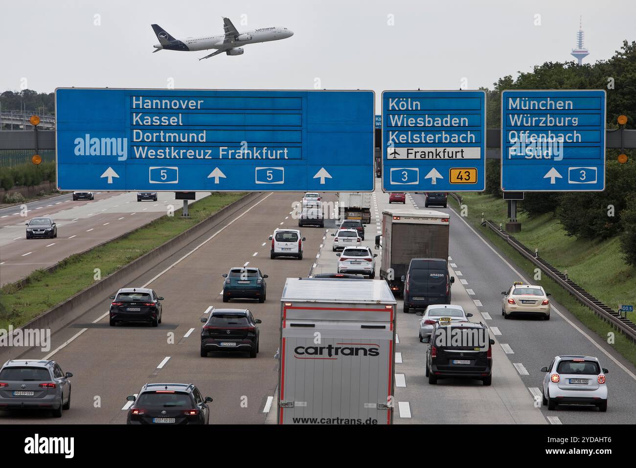 Airplane from the airport above the traffic on the A5 motorway ...