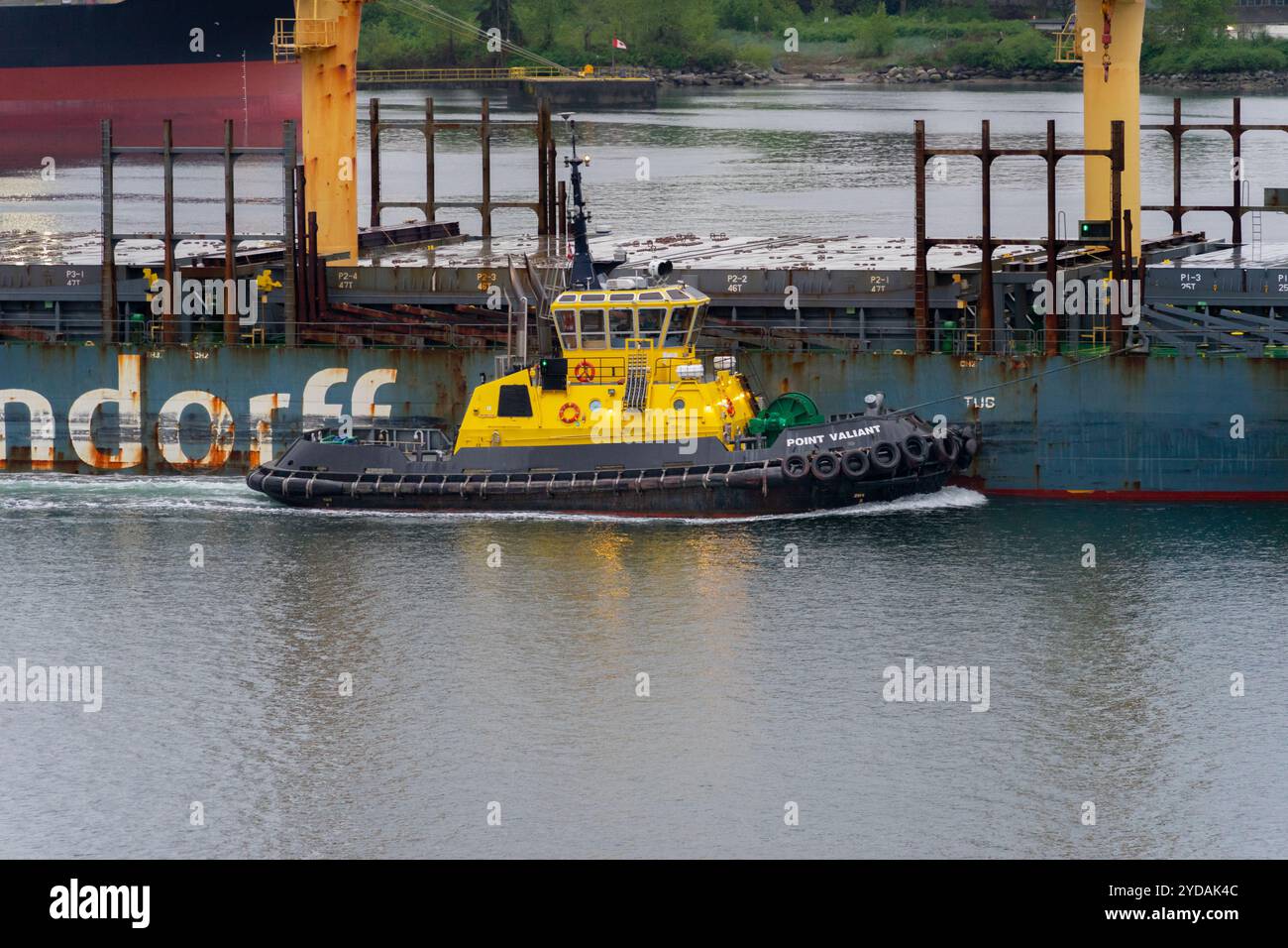Vancouver, BC, Canada - April 26, 2024: A yellow and black tugboat ...