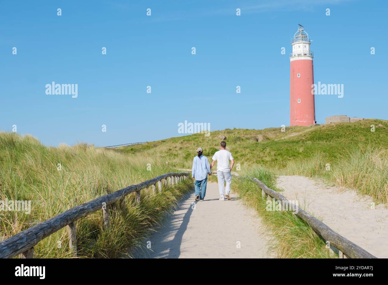 Two people walk along picturesque hi-res stock photography and images ...